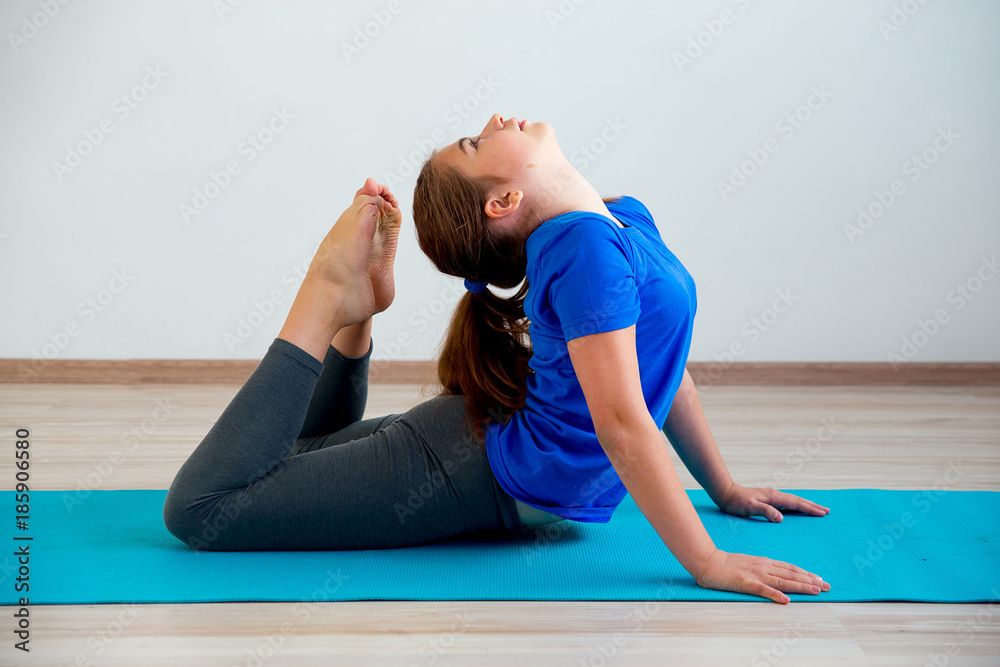 Girl doing exercises Stock Photo | Adobe Stock