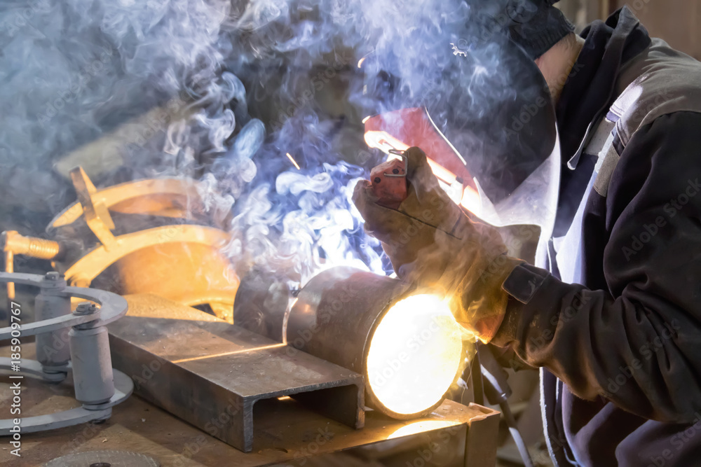 Welder in the shop weld sample from the tube for passing of ...