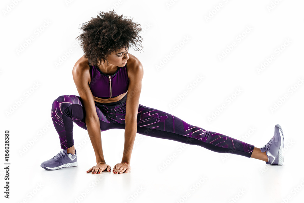 Beautiful young girl stretching her hamstrings. Photo of sporty girl ...