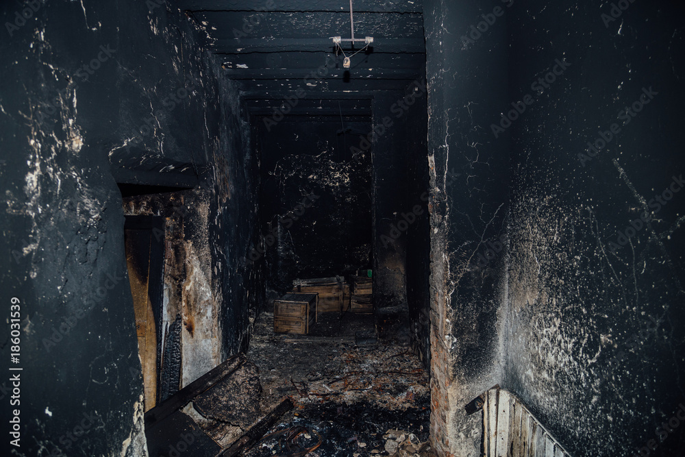 Burned room interior in apartment house. Burned furniture and charred ...
