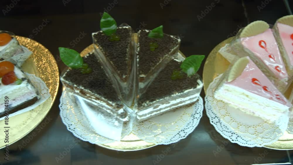 A great variety of cakes. Top view. The camera moves ( from left to ...