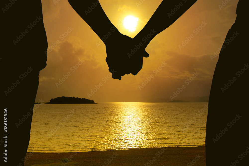 Couple Holding Hands In The Sunset Wallpaper