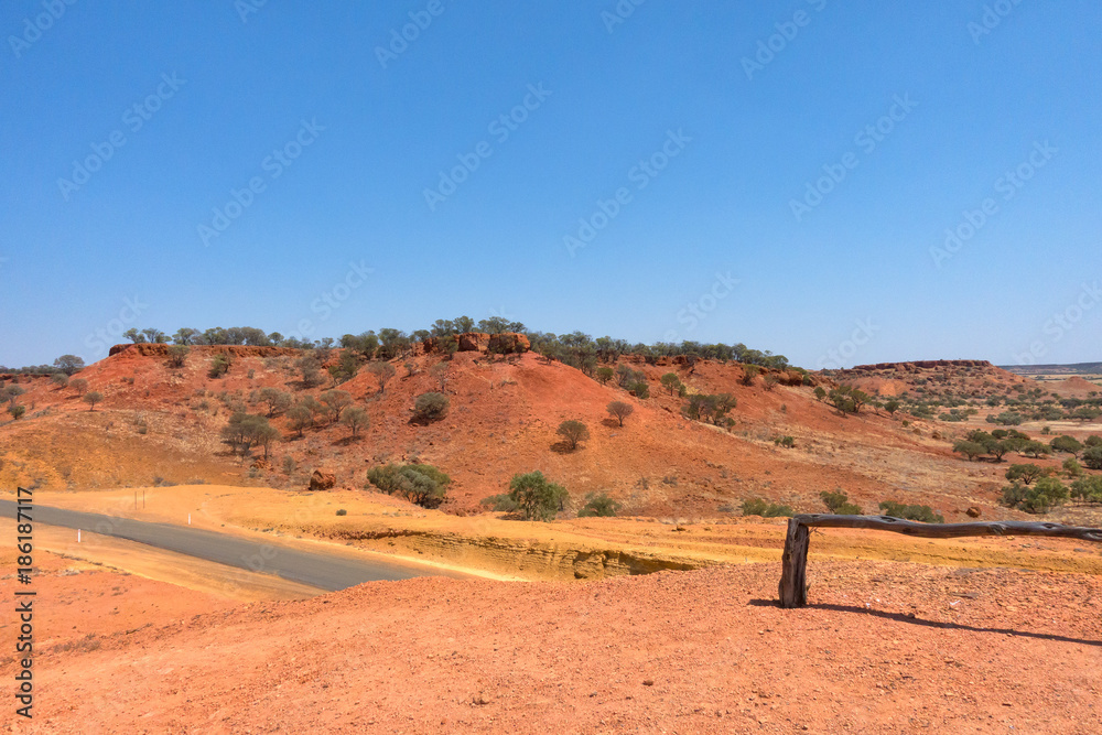 Bitumen road and old boundary fence at cawnpore Lookout in Outback ...