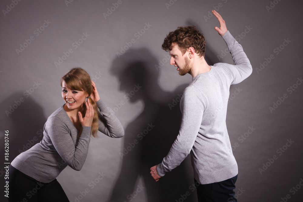 Aggressive man yelling on woman. Stock-Foto | Adobe Stock