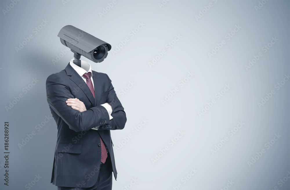 Man with a CCTV camera head, gray Stock Photo | Adobe Stock