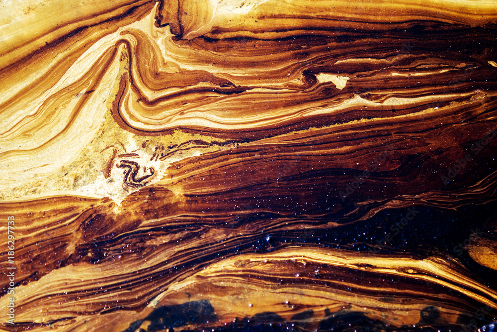 Texture of crude oil spill, pools of crude oil floating on the surface ...