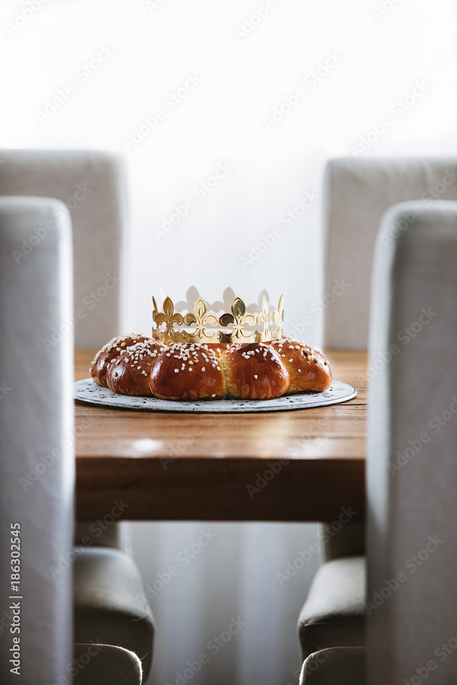Swiss sweet bread with a golden paper crown and hidden miniature of ...