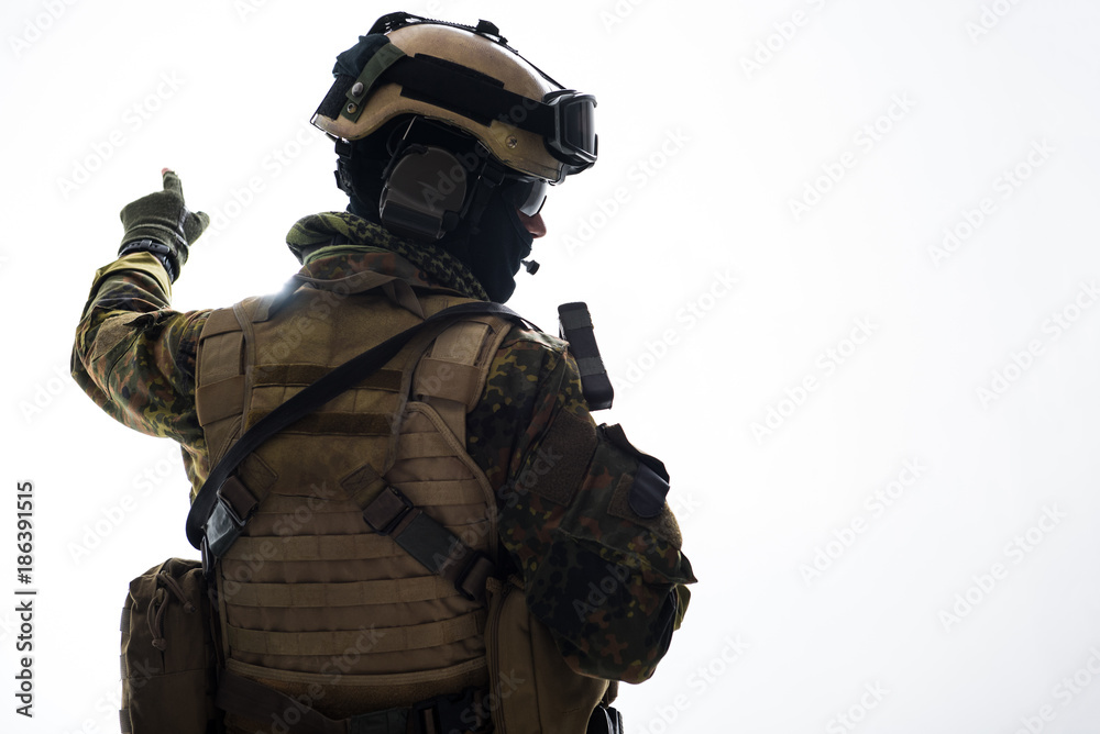 Foto de Back view serious peacemaker telling in microphone while ...