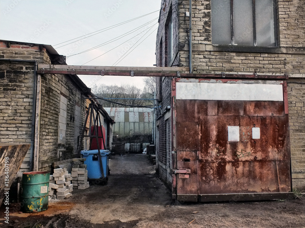 old disused industrial buildings with chemical containers and rusty ...