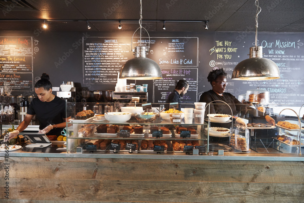 Staff Working Behind Counter In Busy Coffee Shop Stock Photo Adobe Stock