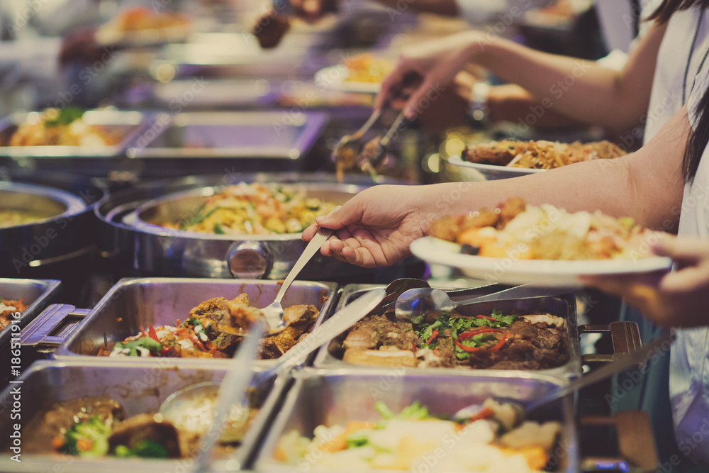 scooping the food. Buffet food at restaurant. Catering food Stock Photo ...