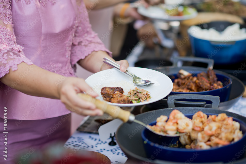scooping the food. Buffet food at restaurant. Catering food Stock Photo ...