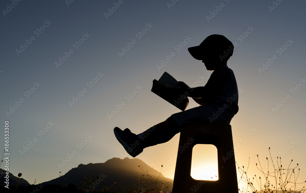 cute little boy reading story book Stock Photo | Adobe Stock
