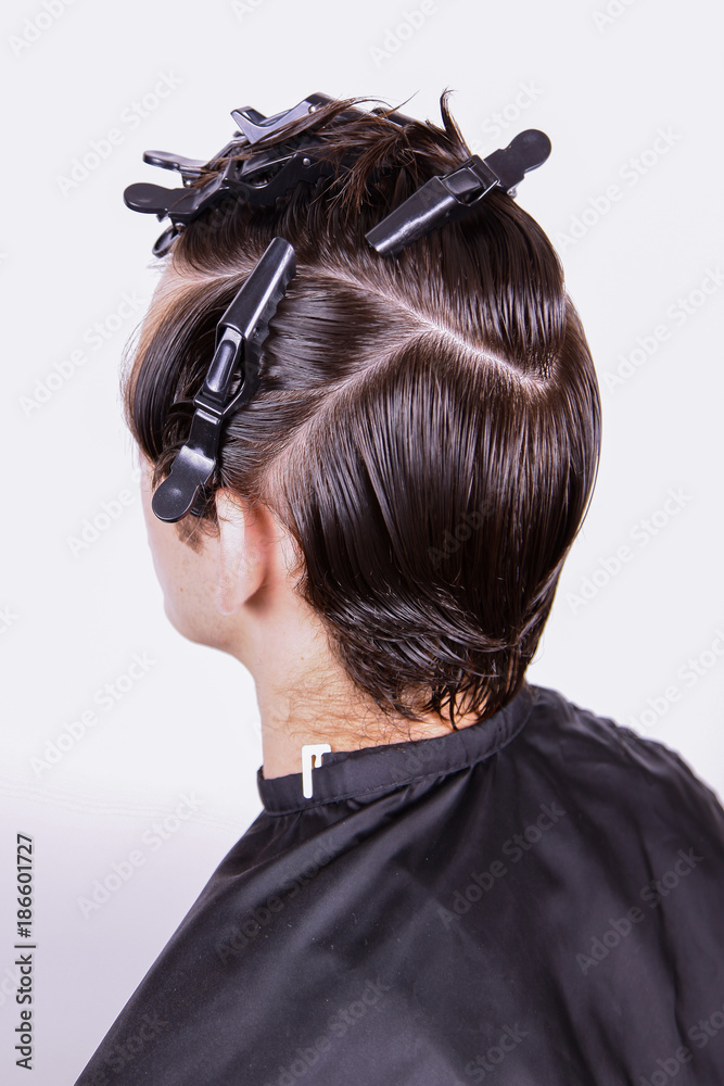 The process of male haircuts. A hairdresser is cutting a guy. Barber ...