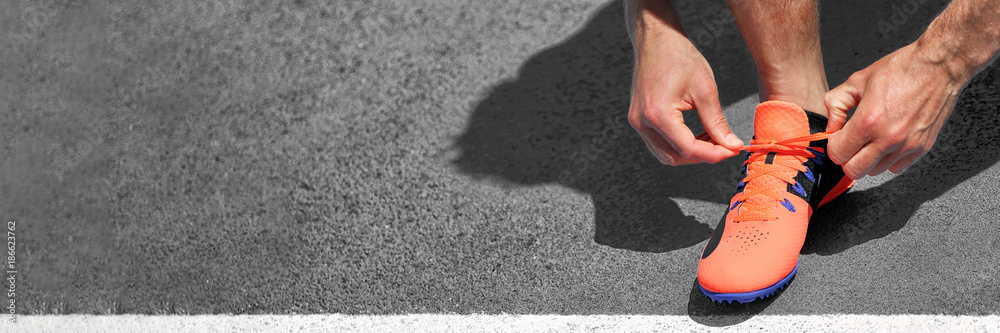 Running track banner crop of athlete runner on starting line ready to ...