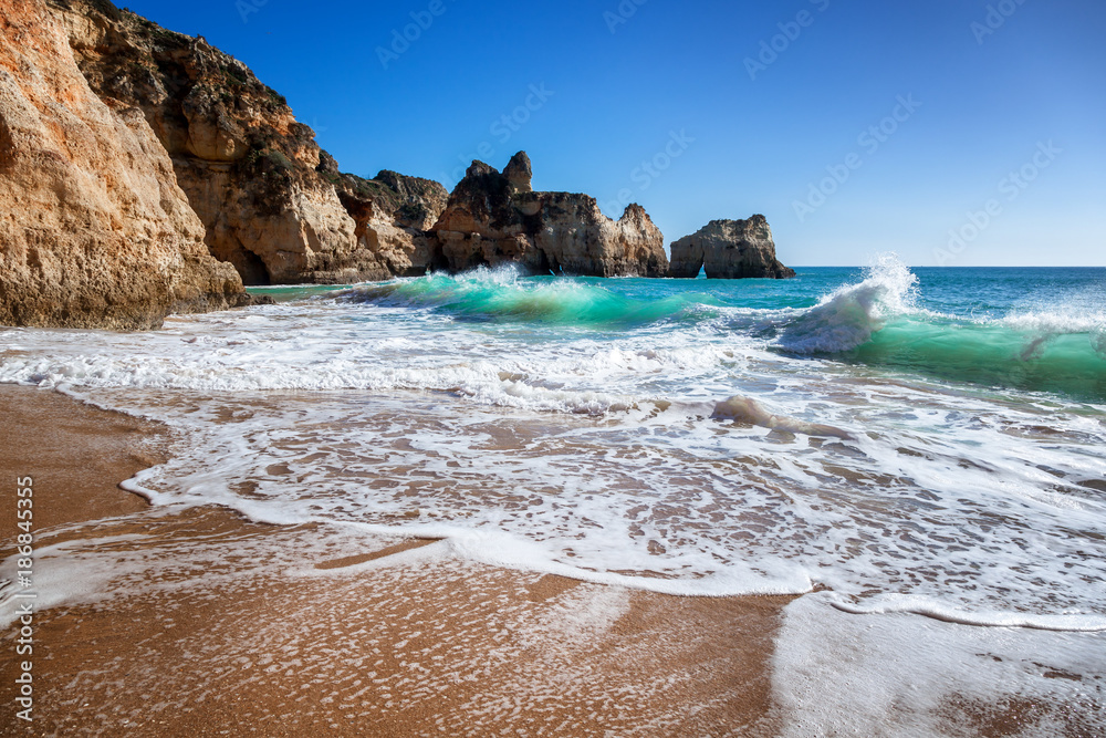 Algarve, Portugal, a stunning sea ocean landscape with yellow rocks and ...