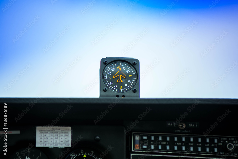 Macro shot of compass. Aircraft equipment, various indicators, buttons ...
