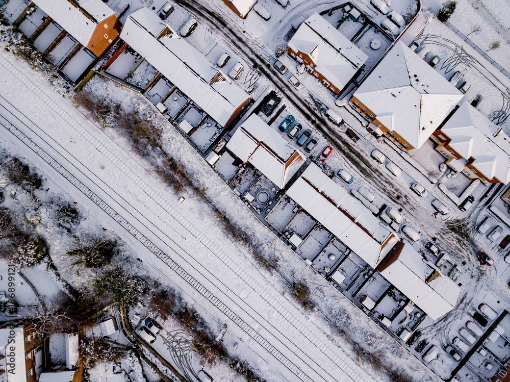 Aerial view of snow covered rail and road networks. Snow, ice and ...