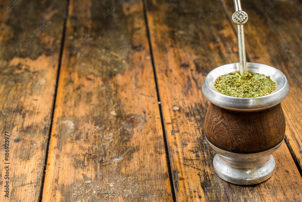 Traditional Argentinian yerba mate tea in a calabash gourd with ...
