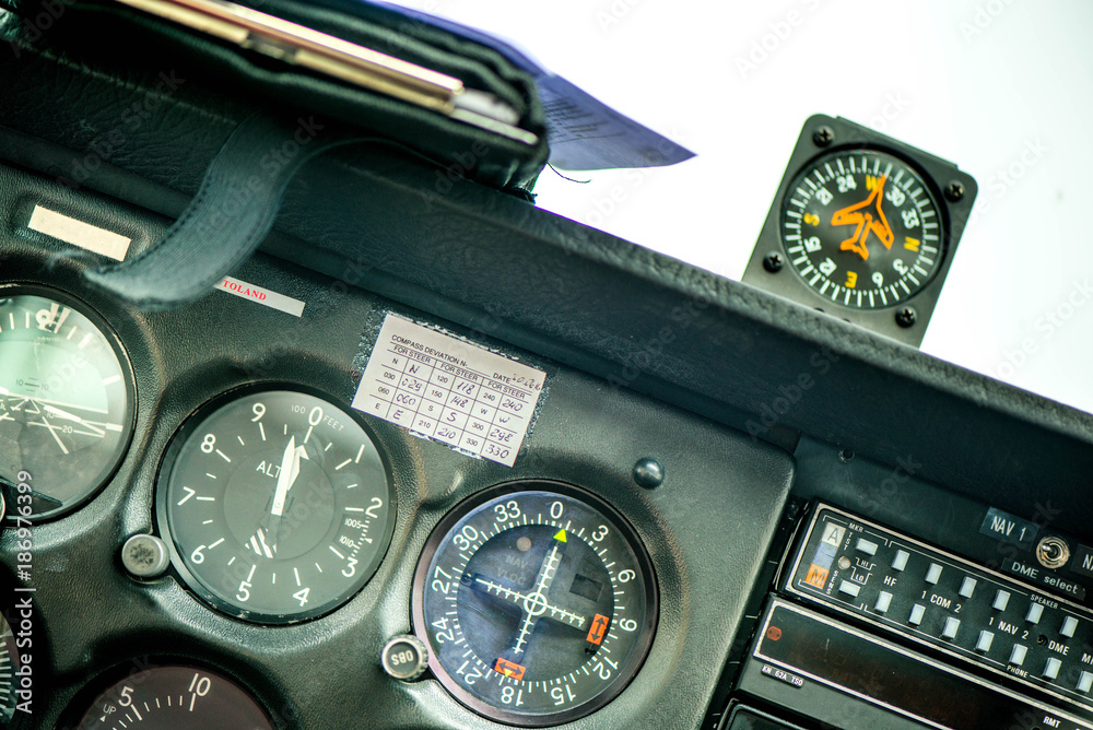Macro shot of compass. Aircraft equipment, various indicators, buttons ...