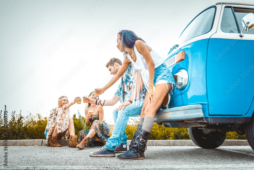 Happy friends driving a vintage minivan Stock Photo | Adobe Stock