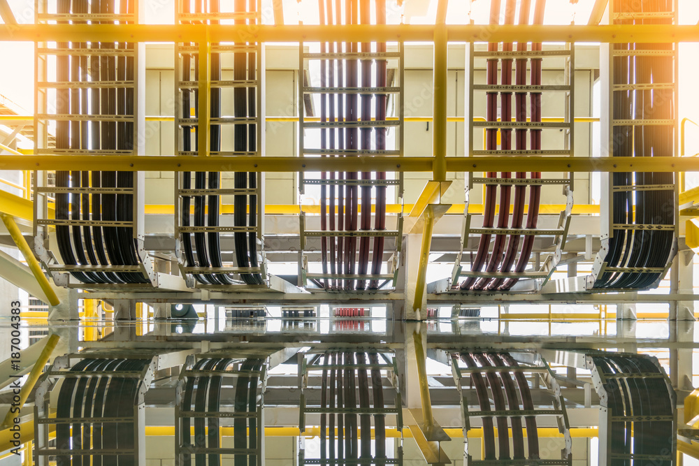 Fotografia do Stock: High and low voltage cables enter to transformer ...
