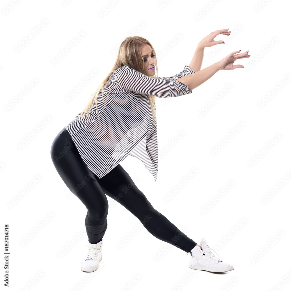 Graceful woman jazz dancer posture swinging arms in rhythm with closed ...