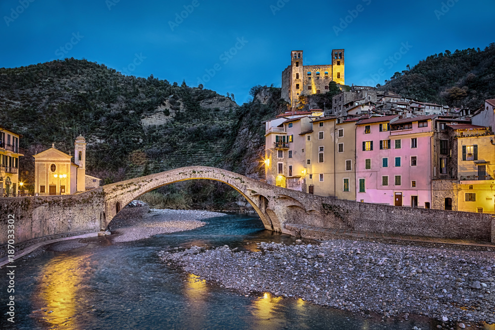 Dolceacqua town at dusk, Liguria, Italy, 15th century Romanesque bridge ...