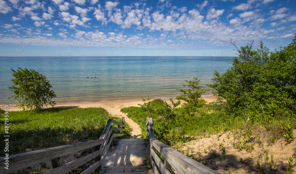 Sunny Summer Beach Background. Stairs lead to a beautiful sandy beach ...