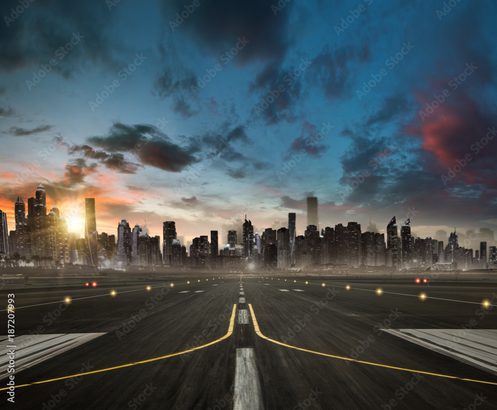Empty airplane runway heading for the modern city with skyscrapers ...