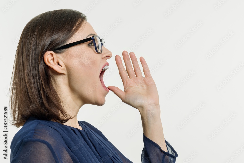 A Woman shouting, screaming portrait in profile, white background ...