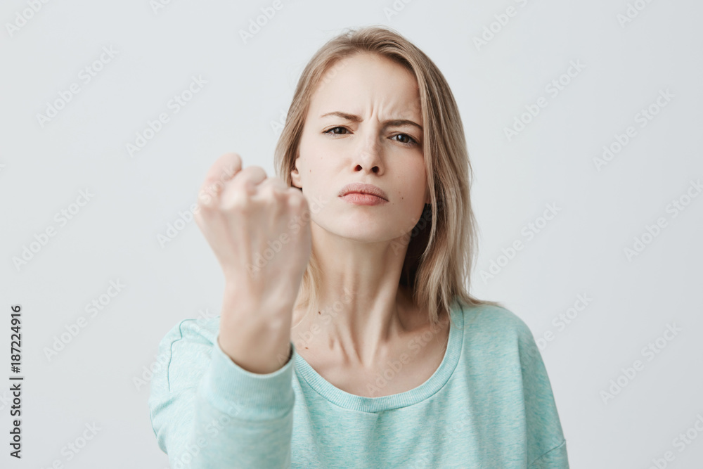 Fierce and confident stylish european female model with blonde long ...