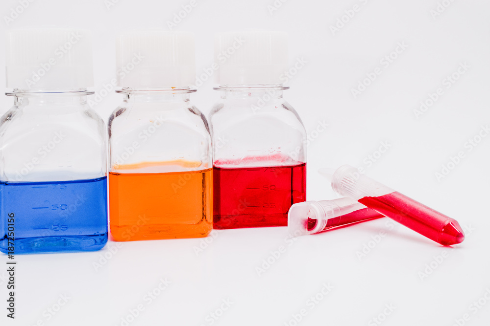 Chemical tubes and flasks with colorful liquids and reagents. Medical ...