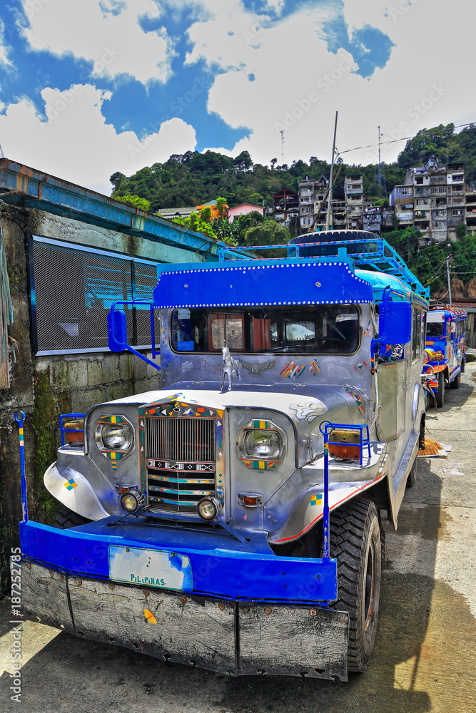 Filipino grey-blue dyipni-jeepney car stationed in Banaue town-Ifugao ...