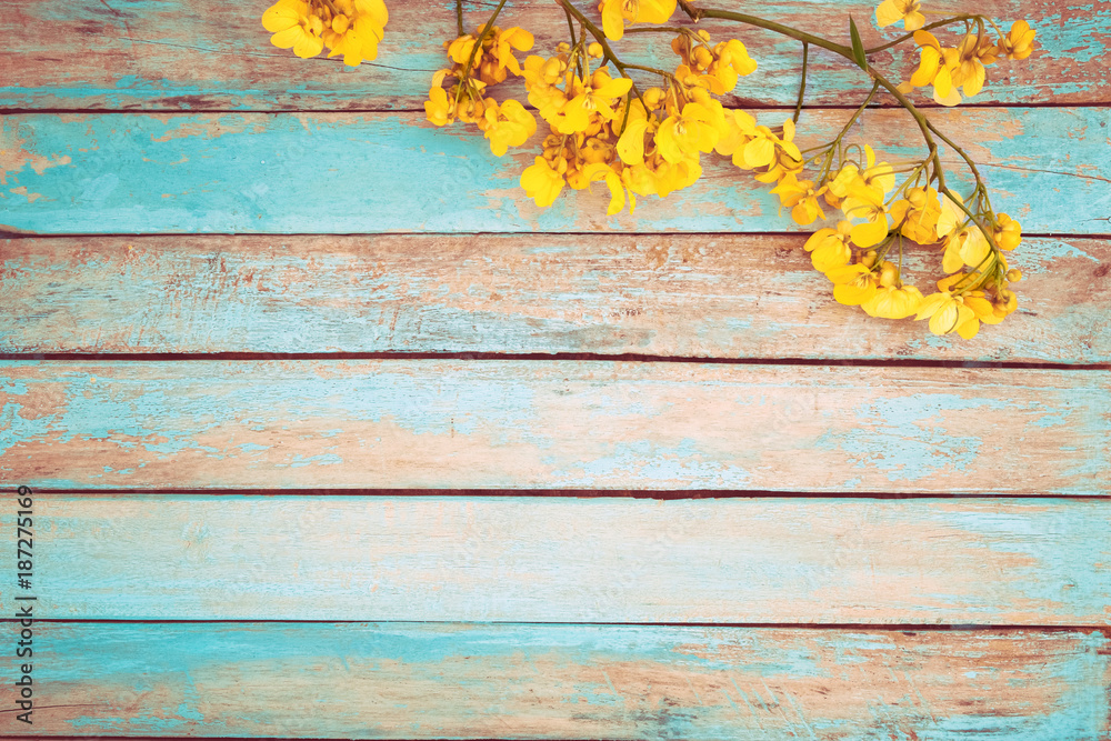 Yellow flowers on vintage wooden background, border design. vintage ...