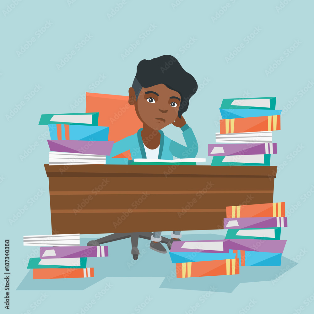 African-american annoyed student studying hard before the exam with a ...