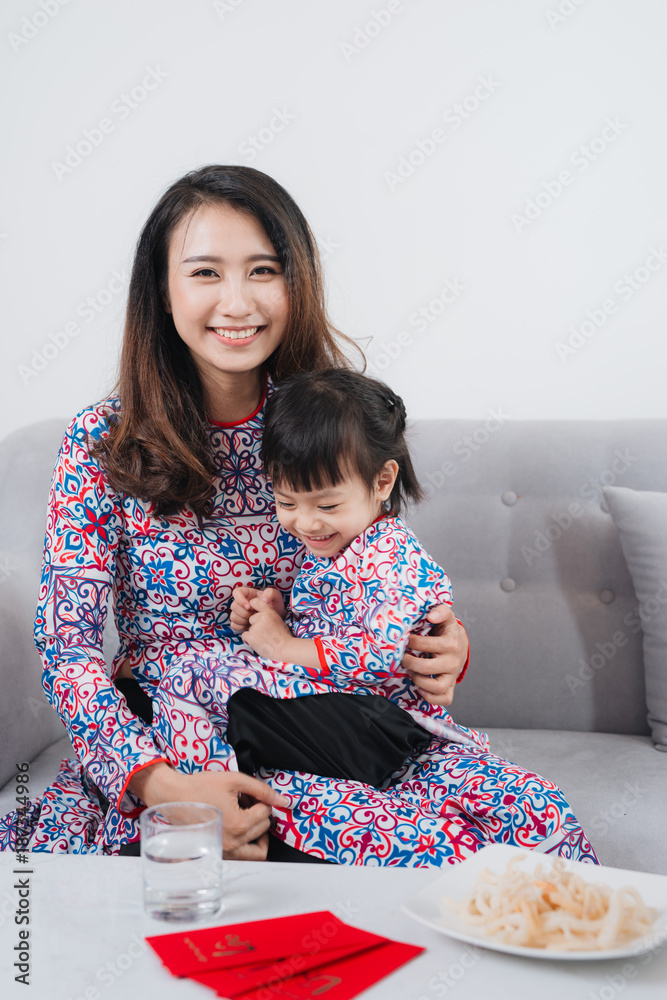 Vietnamese mother and daughter in Ao Dai Traditional dress, celebrate ...