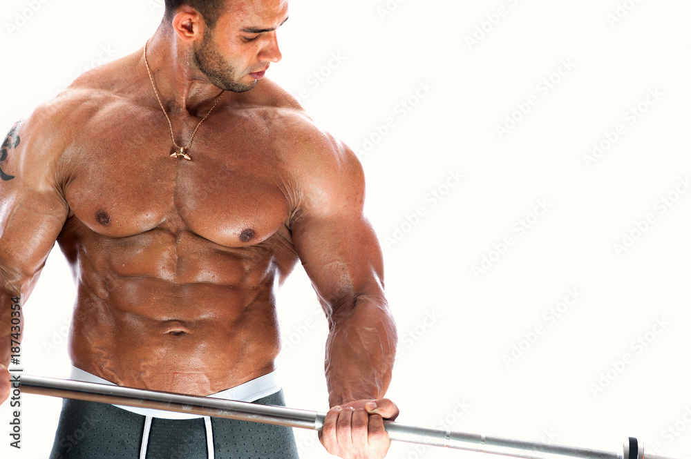 Closeup of handsome male fitness model posing shirtless showing perfect ...