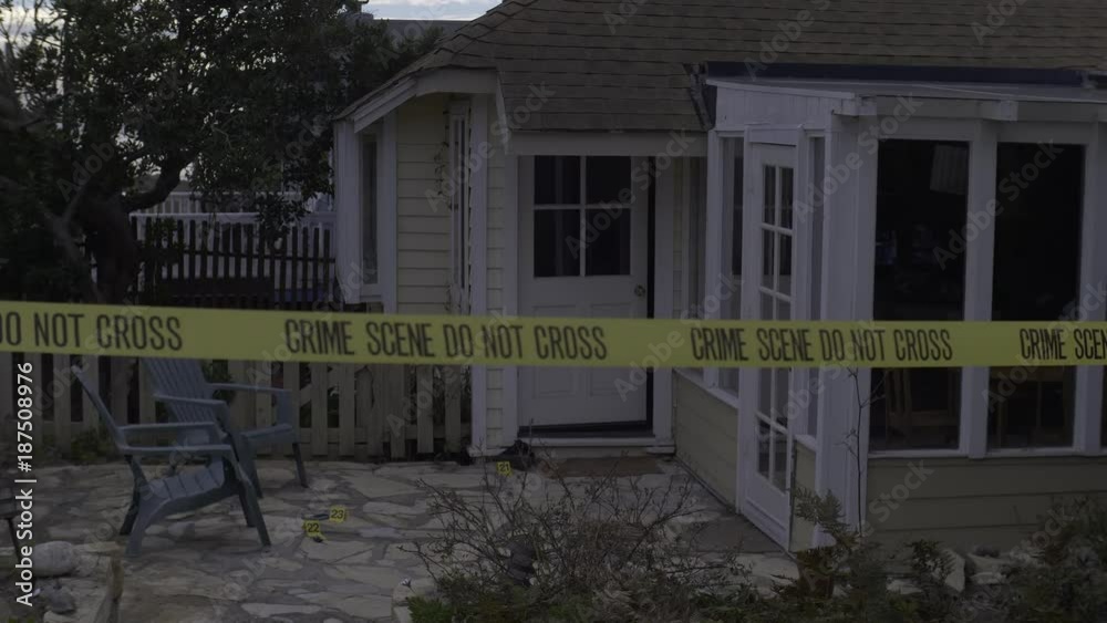 RESIDENTIAL CRIME SCENE, IN 4K. Beach house exterior with marked ...