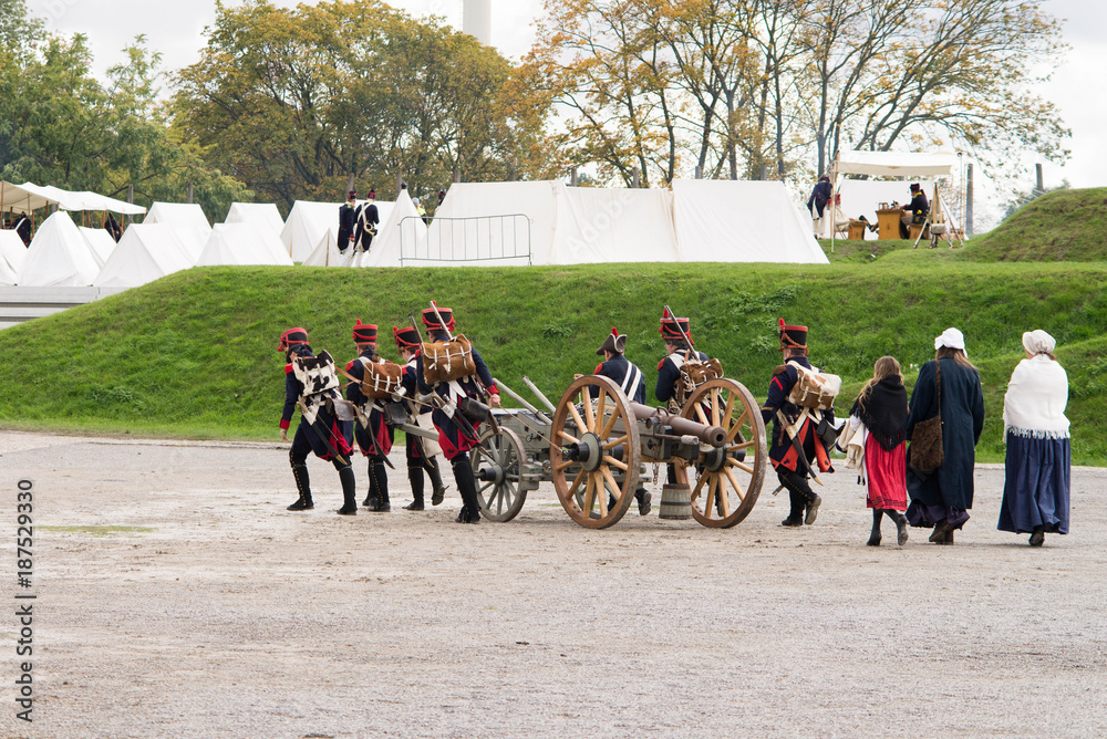 Napoleonic soldiers and their women are marching to a military camp ...