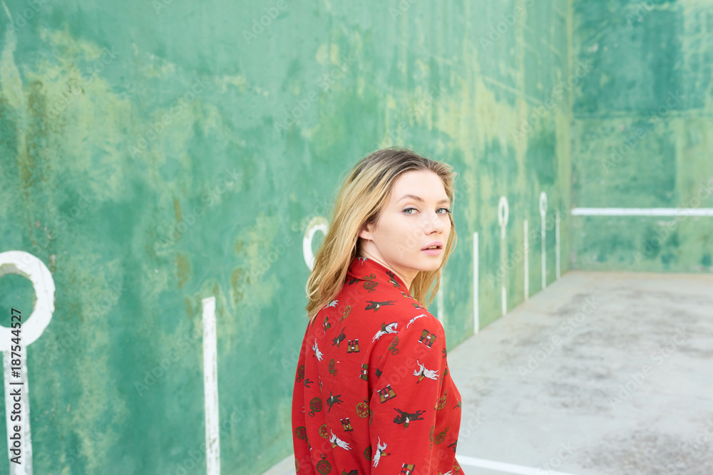 Pretty blonde girl looking back at camera. Stock Photo | Adobe Stock