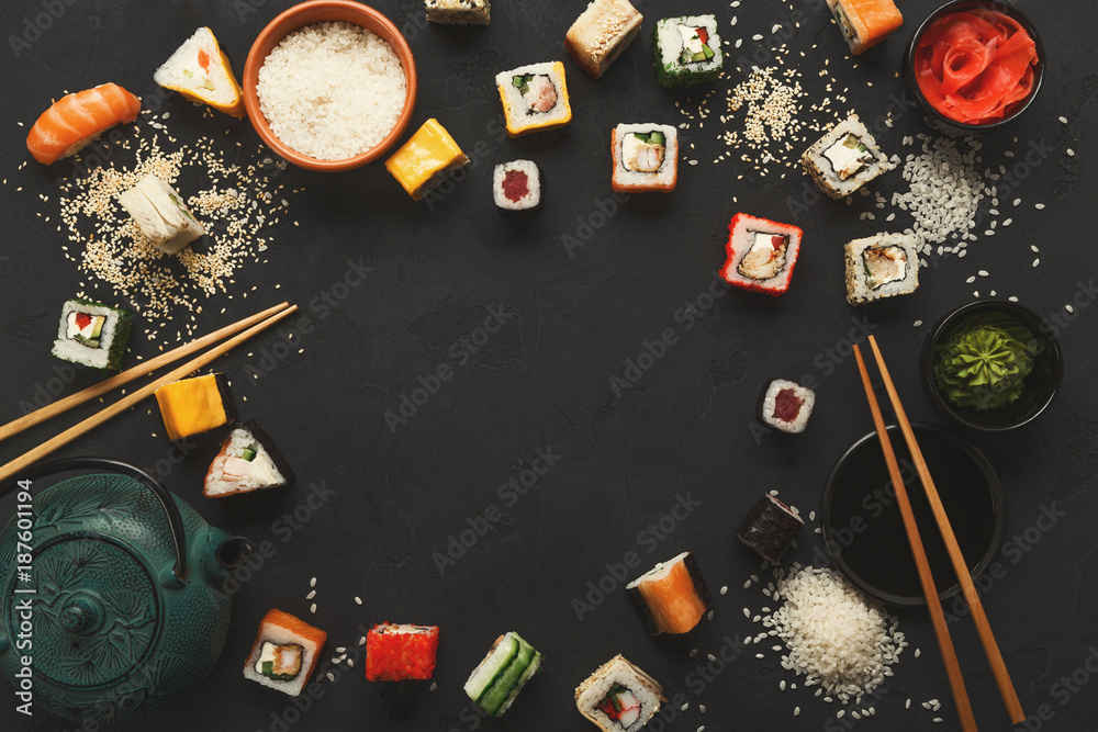 Sushi and rolls background, frame on black, top view. Stock Photo ...