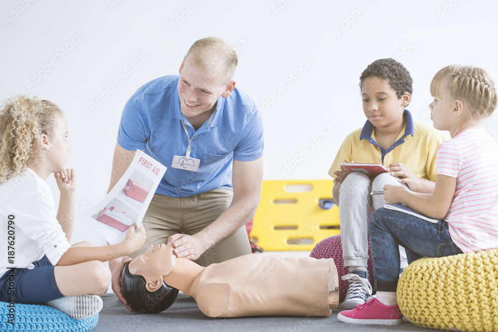 Boy with first aid instruction Stock Photo | Adobe Stock