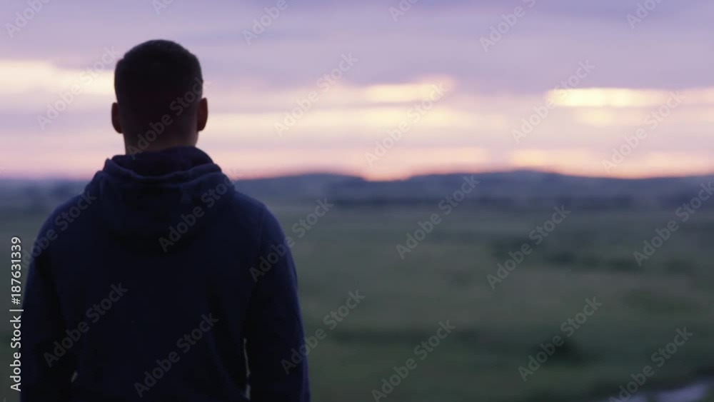 Successful man looking up to sunset sky celebrating enjoying freedom ...