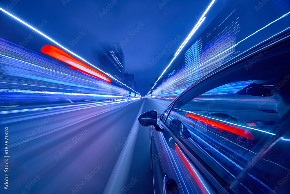 View from Side of Car moving in a night city, Blured road with lights ...