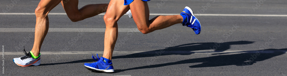 marathon runners legs running on city road Stock Photo | Adobe Stock