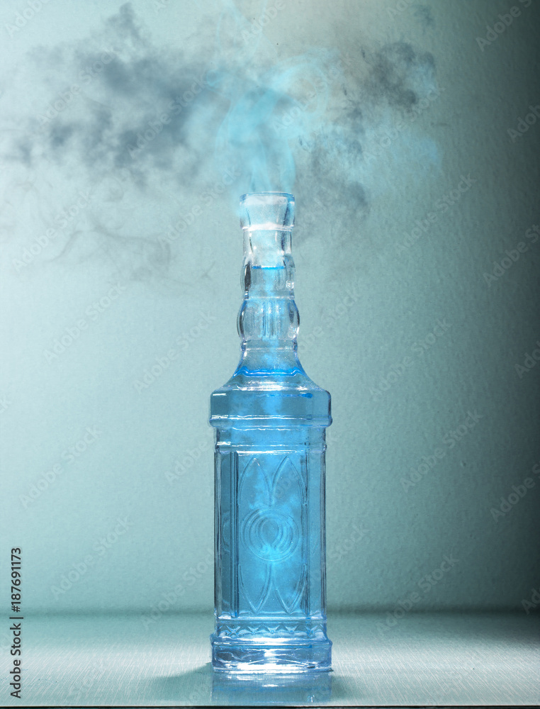Blue magic potion releasing smoke and fume from a bottle 스톡 사진 | Adobe ...