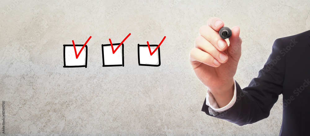 Checklist with businessman on gray wall background Stock Photo | Adobe ...