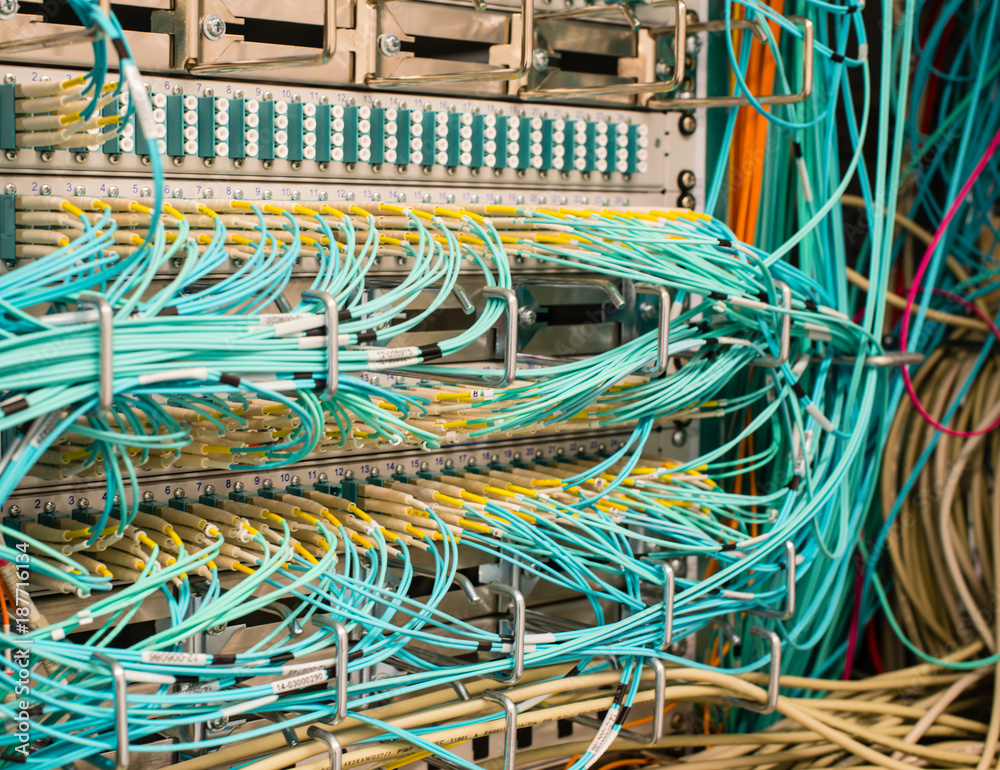 Fiber Optic Light Waveguide On A Switch In The Data Center Stock Photo fiber-optic-light-waveguide-on-a-switch-in-the-data-center-stock-photo