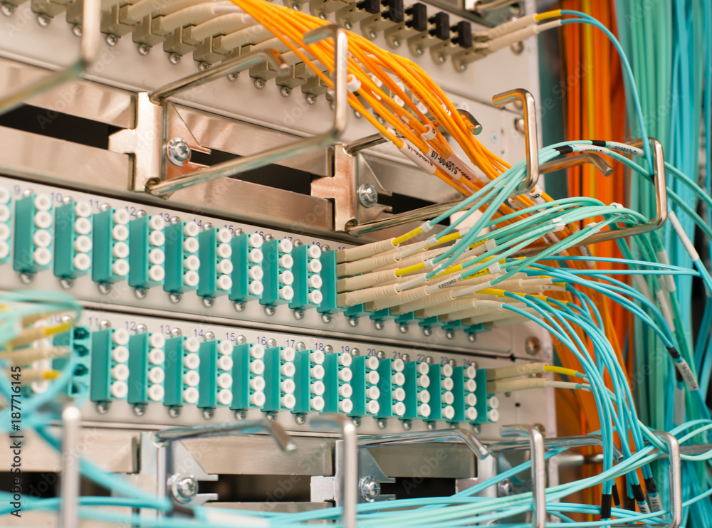 Fiber Optic Light Waveguide On A Switch In The Data Center Stock Photo fiber-optic-light-waveguide-on-a-switch-in-the-data-center-stock-photo